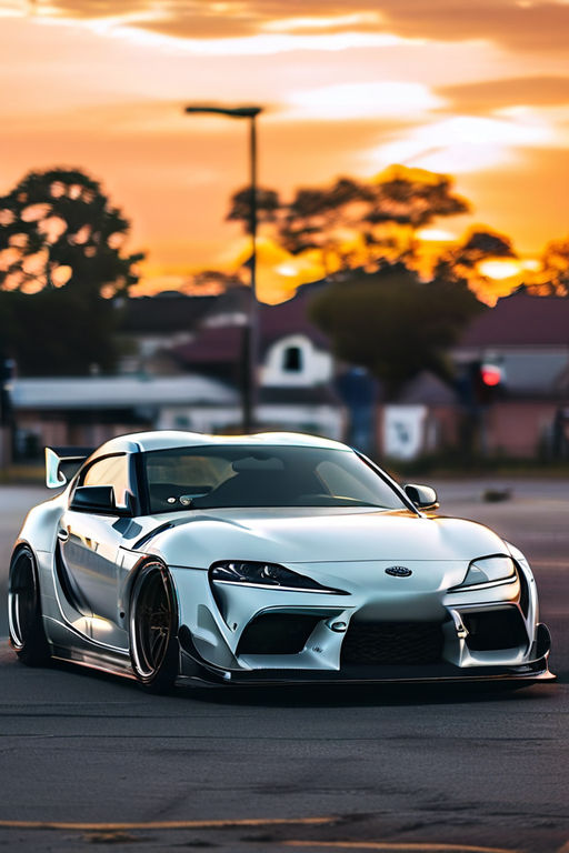 A bagged white Toyota supra MK4 with cambered parked at a ju... by Mhd ...