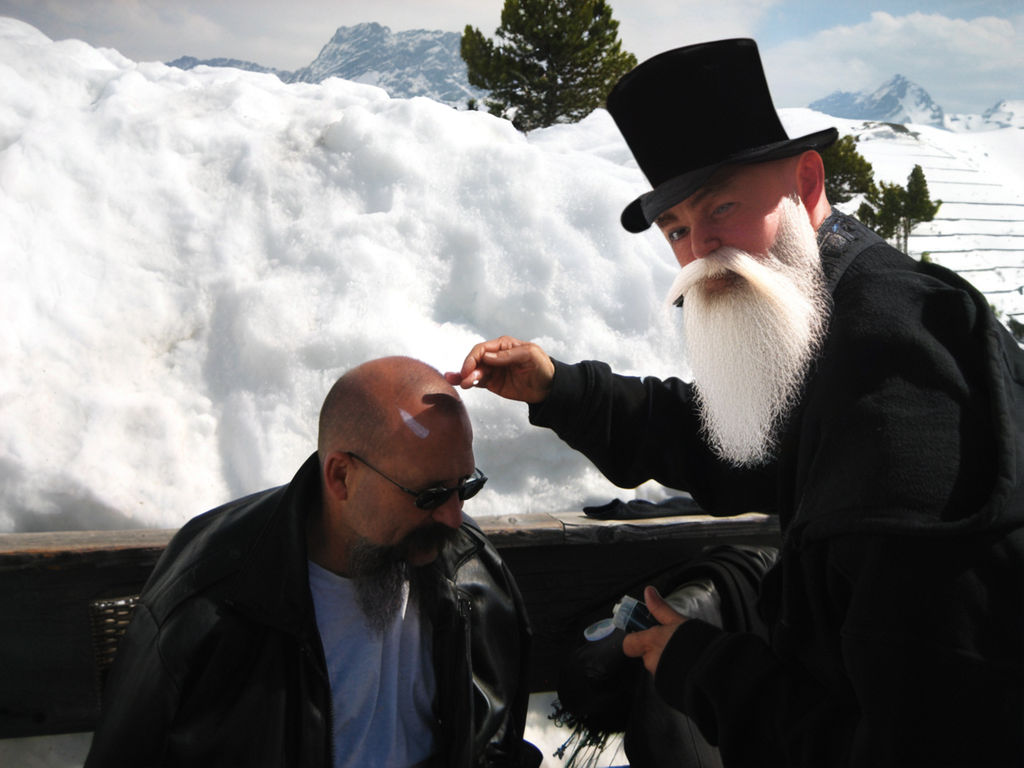 Change the woman into an old balding bearded man with big mu... by ...